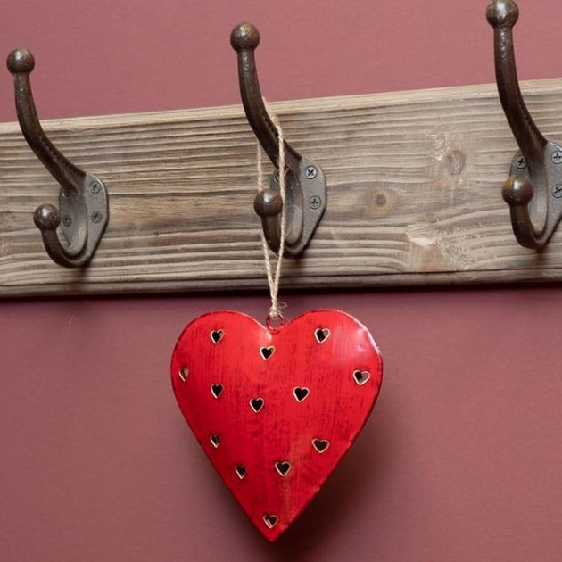 Small hanging metal heart golden cutting – Crossroads Collective
